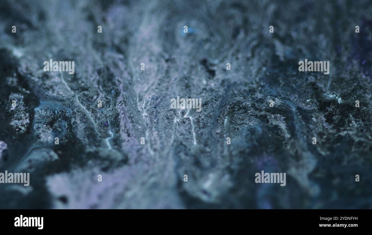 Sparkling ink drip. Wet glitter flow. Defocused blue black paint ...