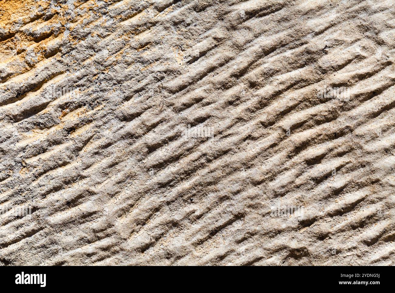 Texture of stone with grooves used for building an ancient fortress ...