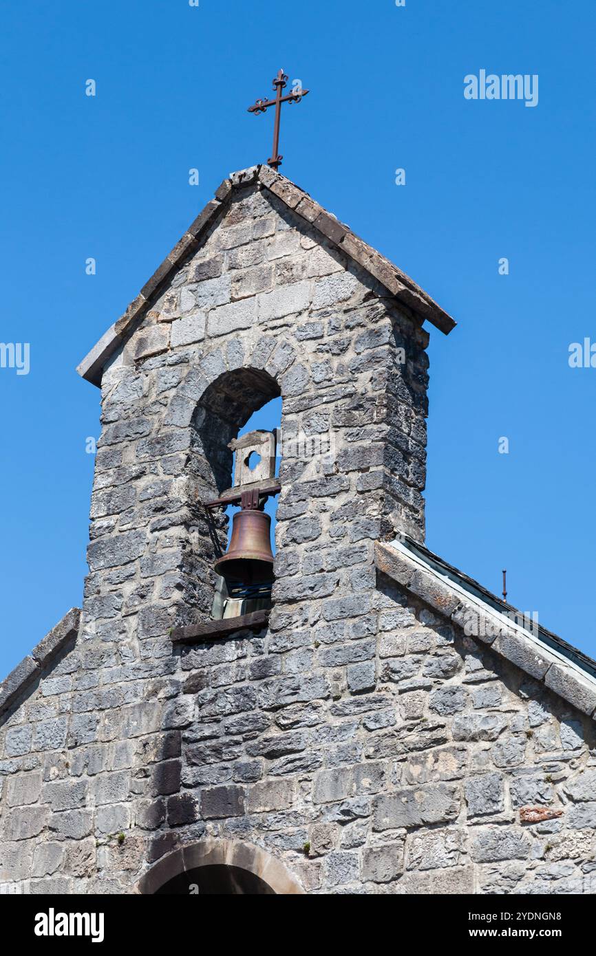 In the French Pyrenees, a charming stone chapel softly chimed ...