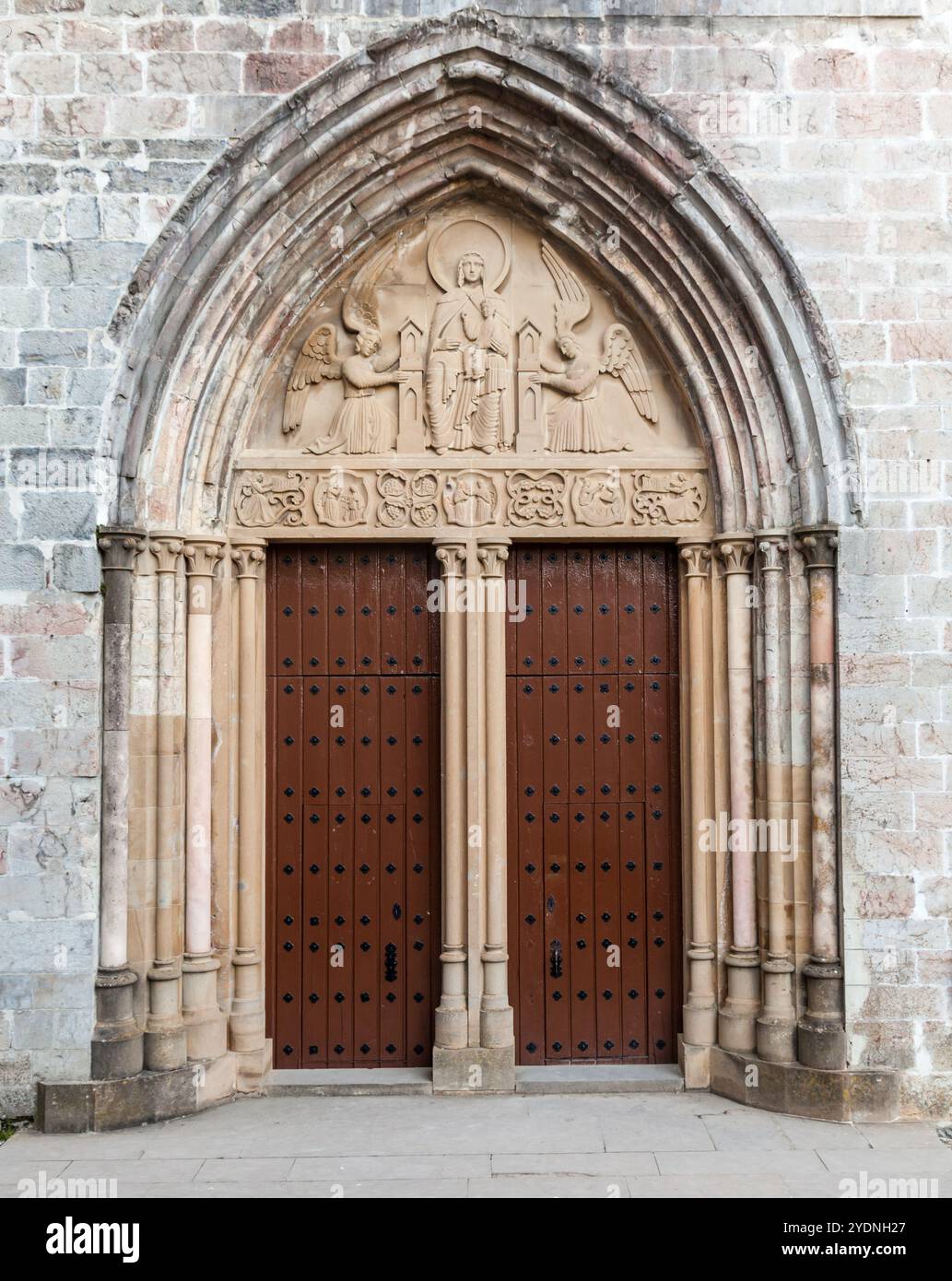 Wander through time at an ornate church entrance nestled in the French ...
