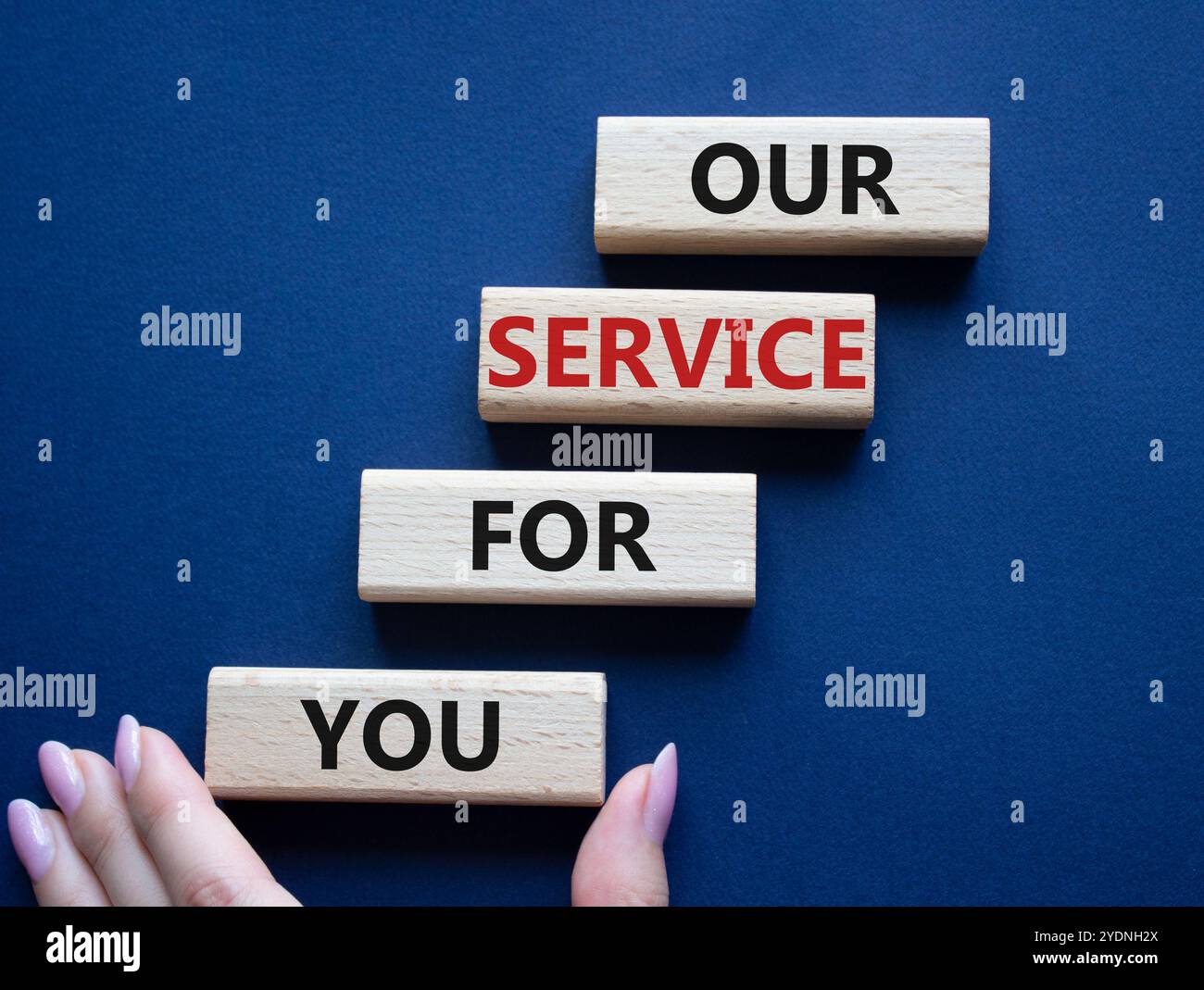 Our service for you symbol. Wooden blocks with words Our service for ...