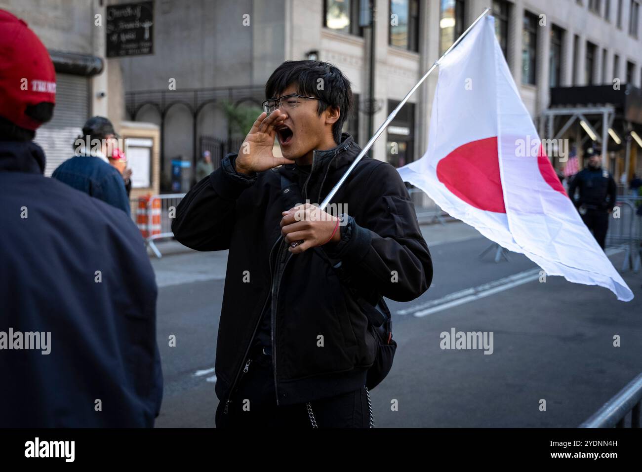 Shin Hosh chants, "USA! USA!" for he new arrivals to the line for Trump ...