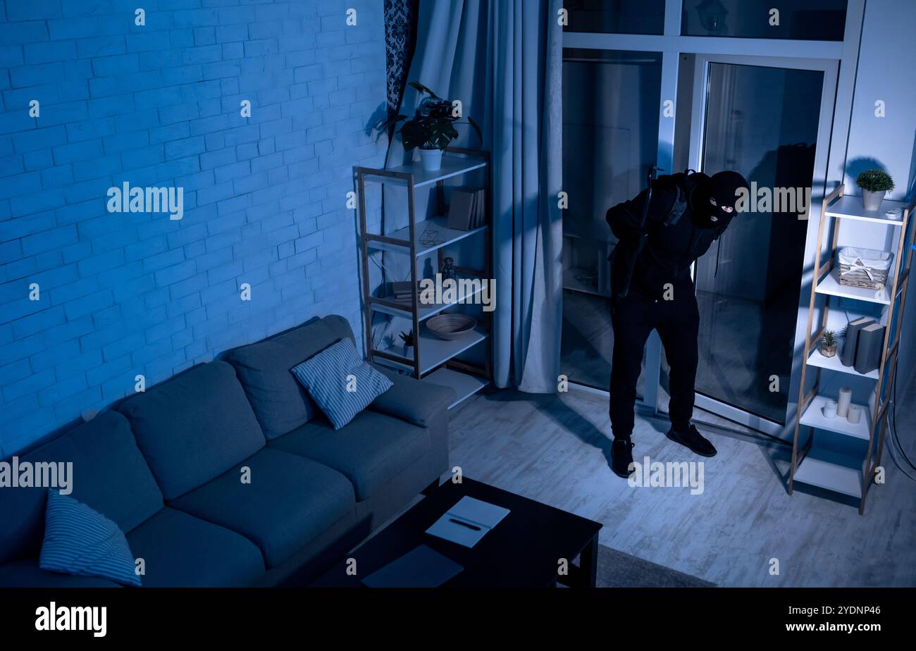 Thief With Crowbar Entering House View From Camera Stock Photo - Alamy