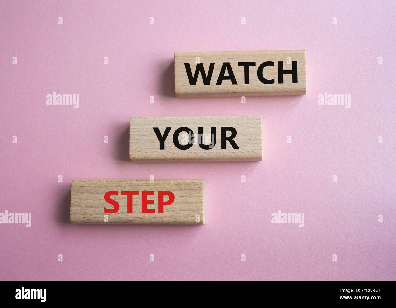 Watch your Step symbol. Concept words Watch your Step on wooden blocks ...