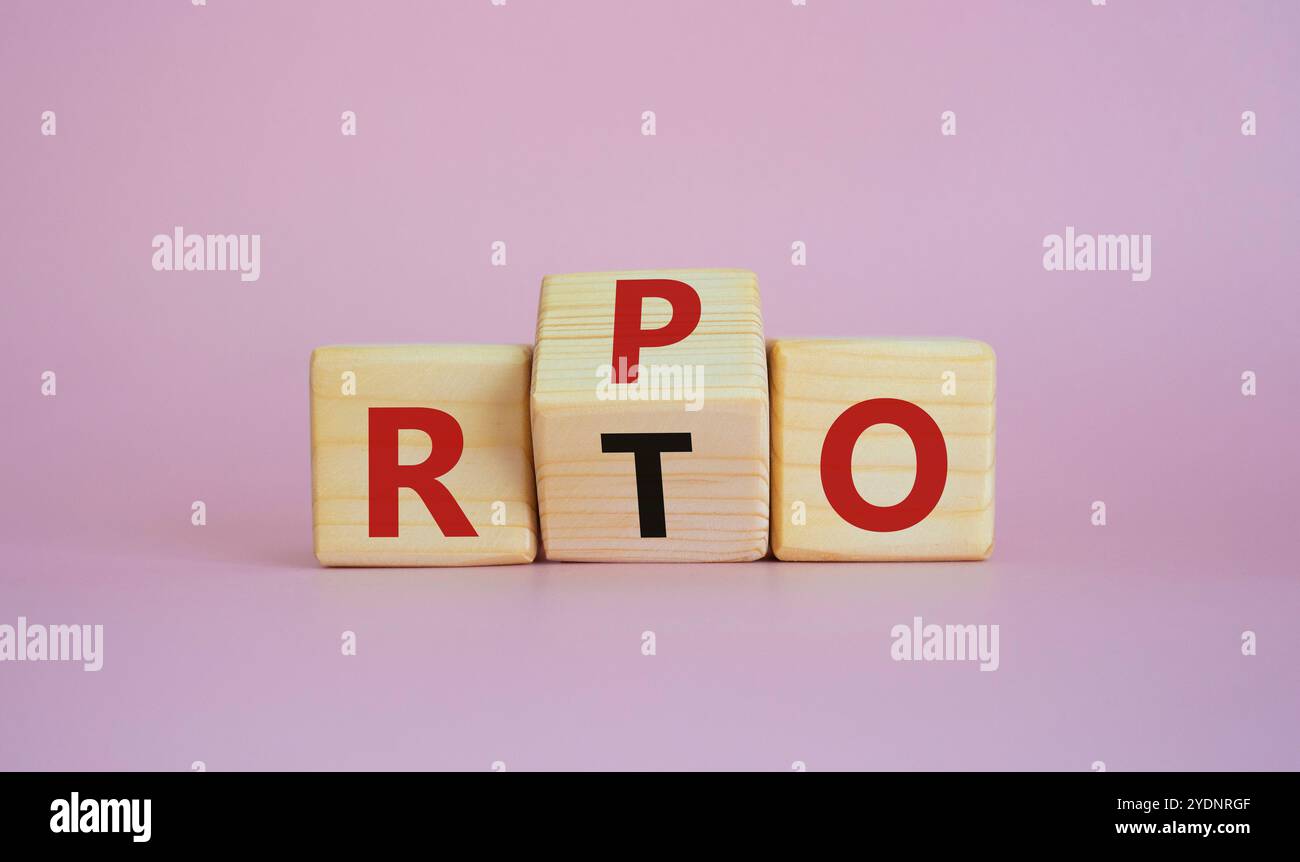 RPO vs RTO symbol. Wooden cubes with words RTO to RPO. Beautiful pink ...