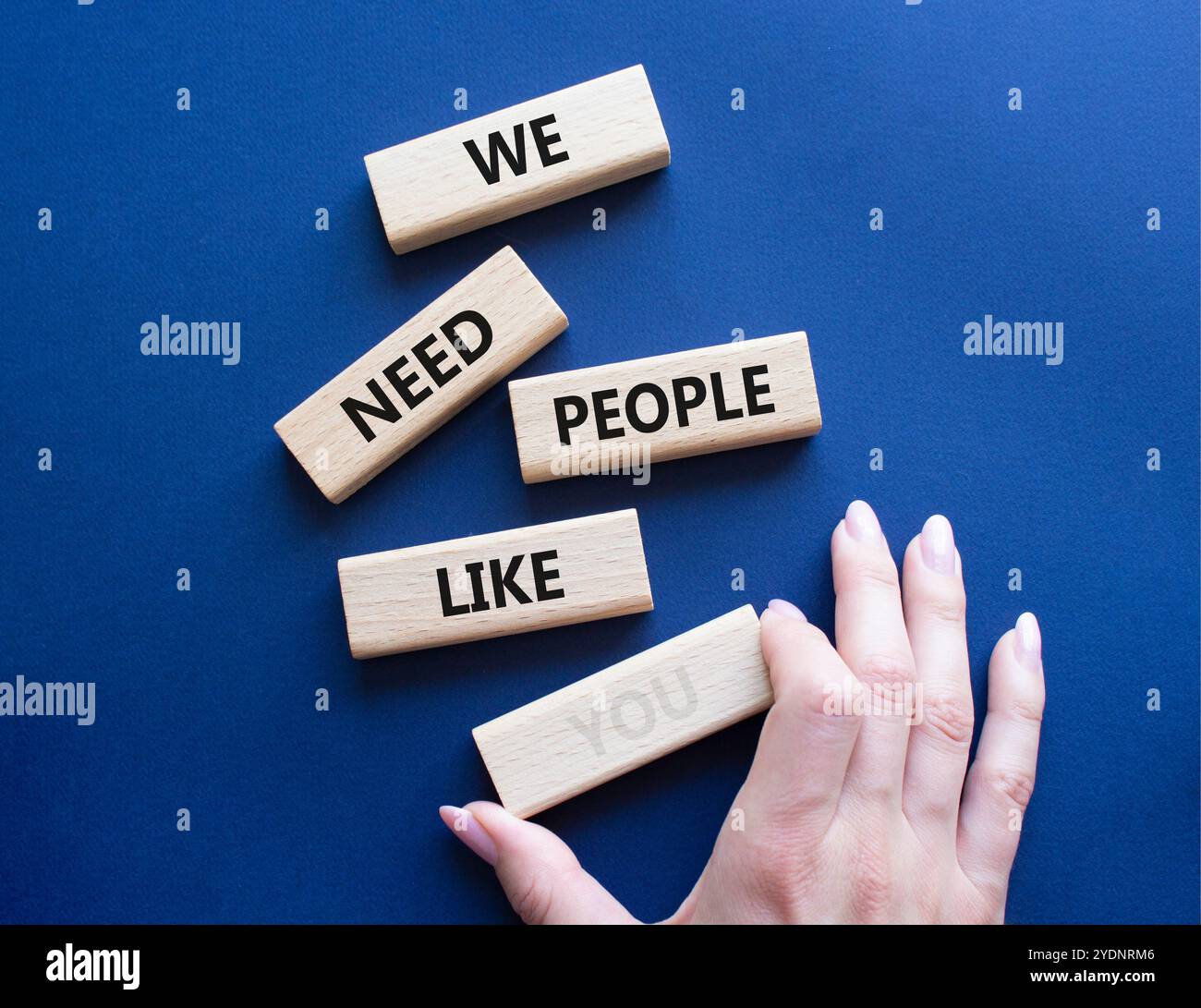 Hiring symbol. Wooden blocks with words We need People like You ...