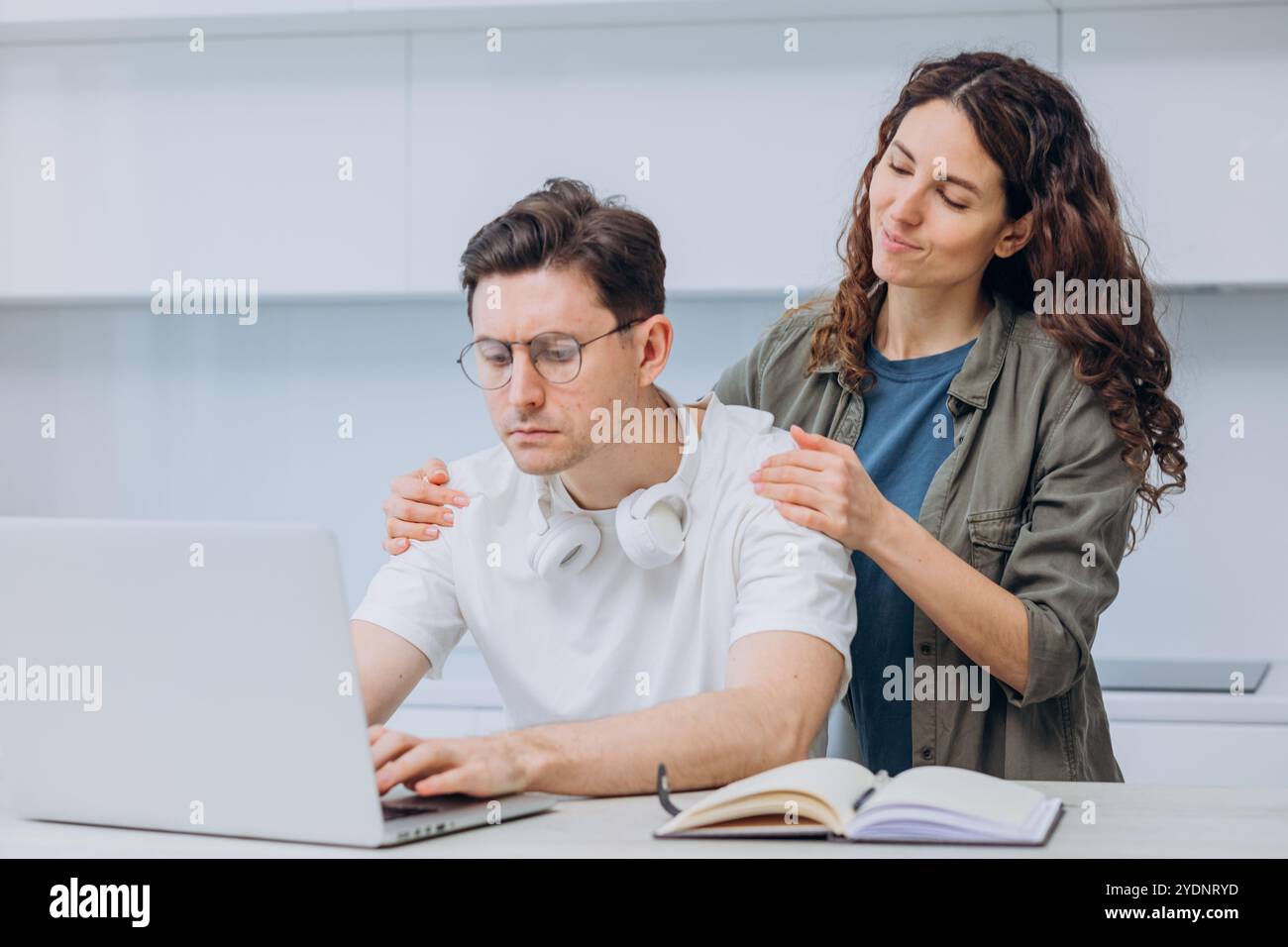 Woman offering help man sitting hi-res stock photography and images - Alamy