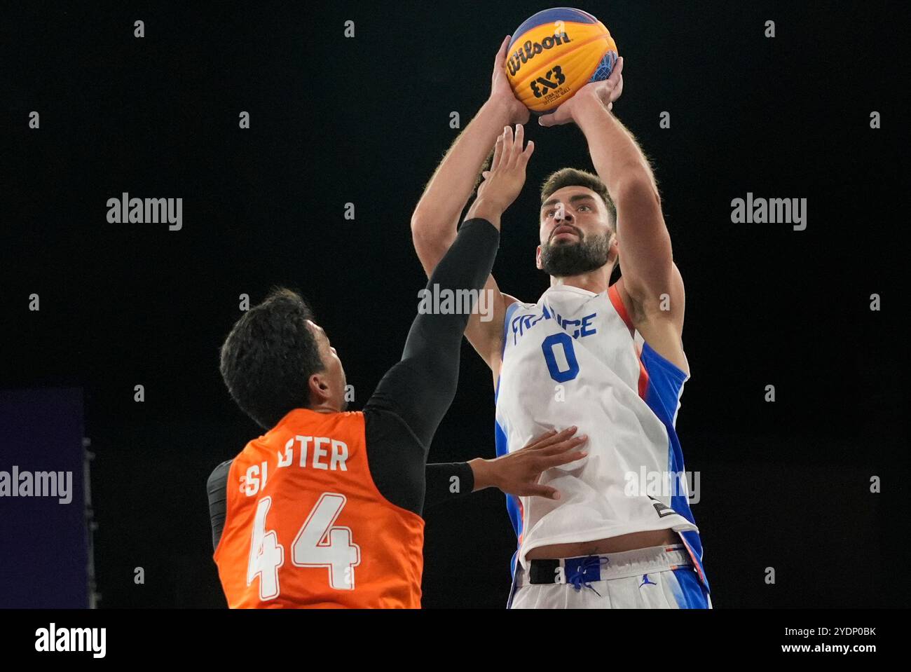 Lucas Dussoulier (0), of France, shoots the ball over Arvin Slagter (44 ...