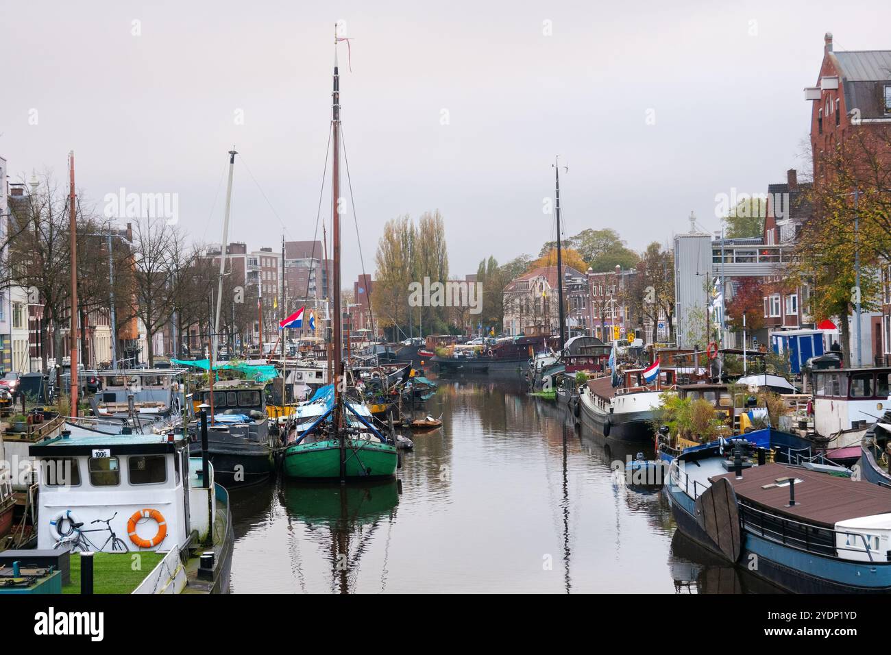 Canal full of boats and houseboats in the Dutch city of Groningen Stock ...