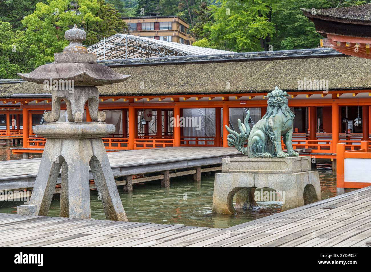 Hiroshima, Japan - August 20, 2024 : Ishidoro stone lantern and komainu ...