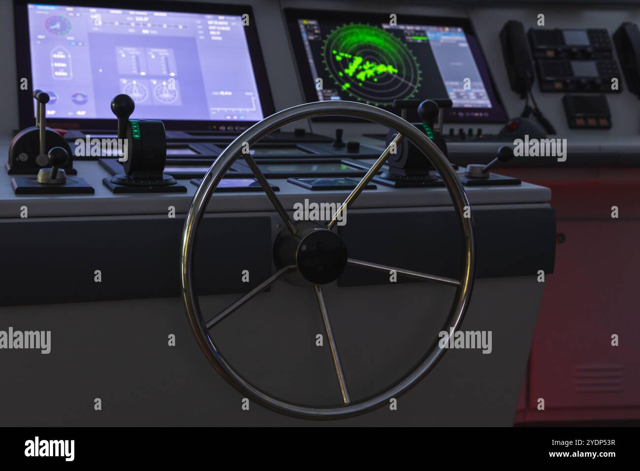 Ship control panel with steering wheel and engine accelerators. The ...