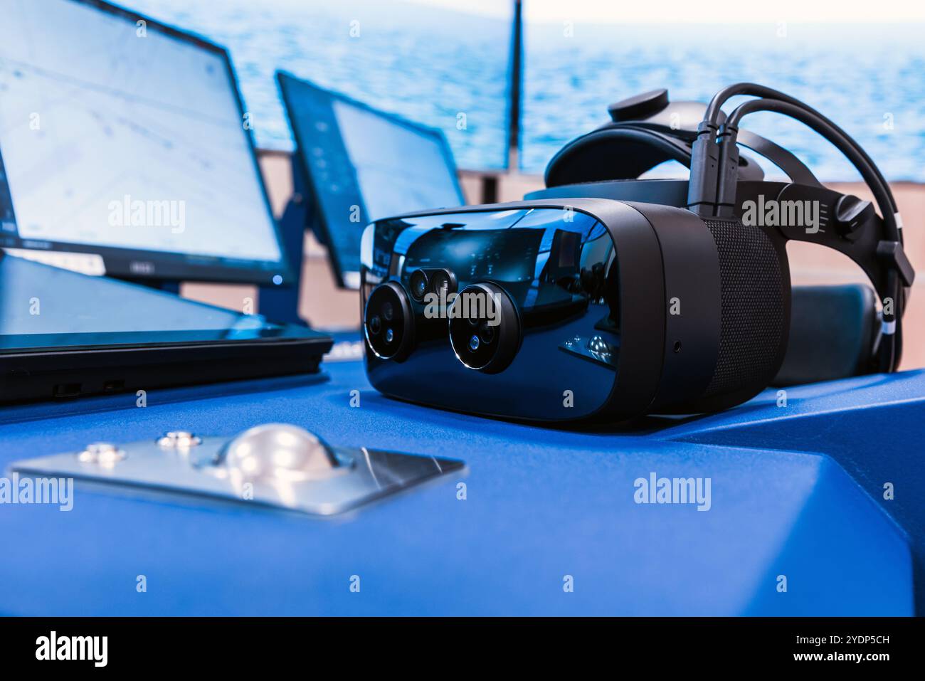 Ship control panel with VR headset laying on it, marine navigation ...