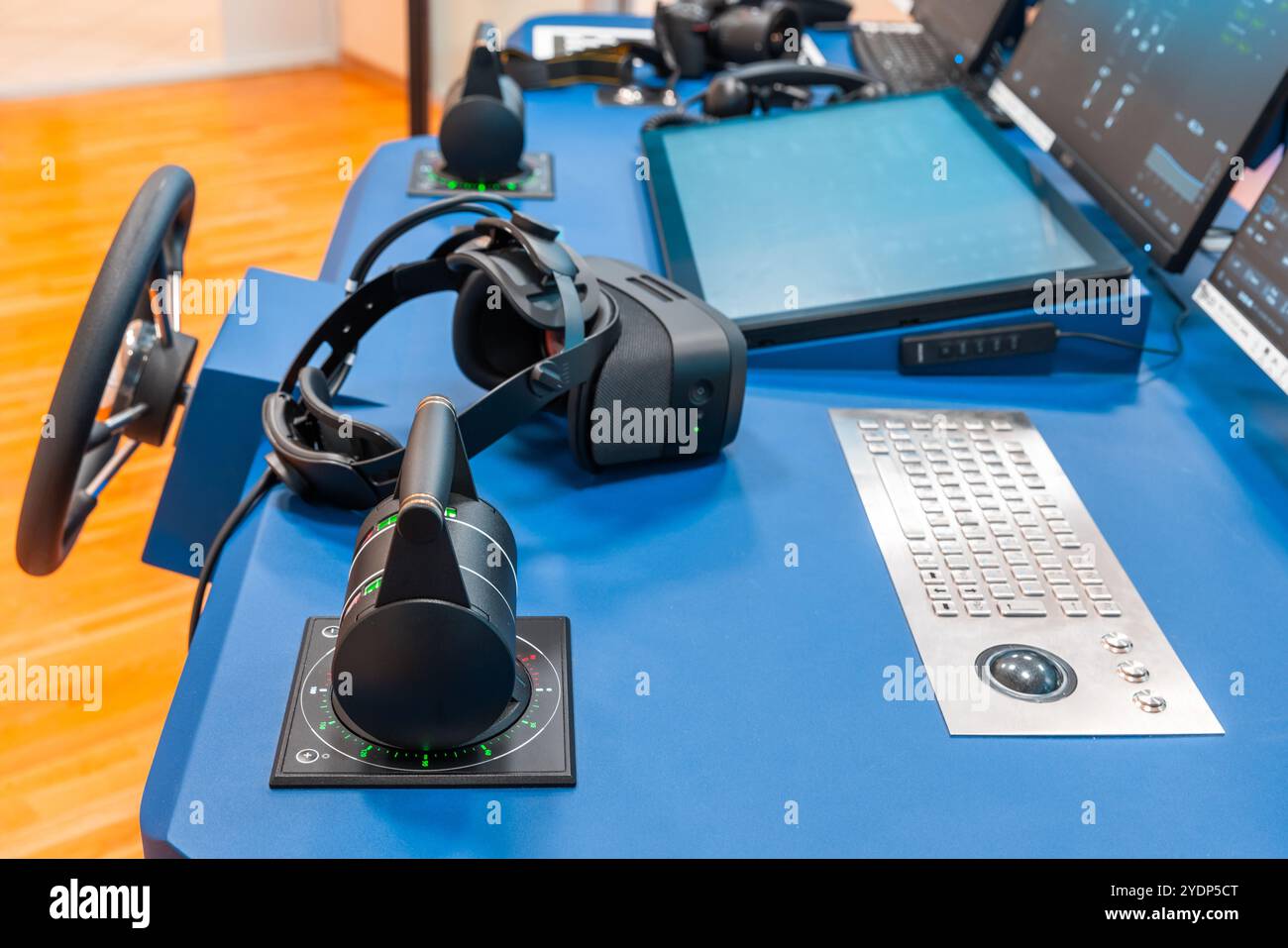 Blue vessel control panel with VR headset laying on it, marine ...