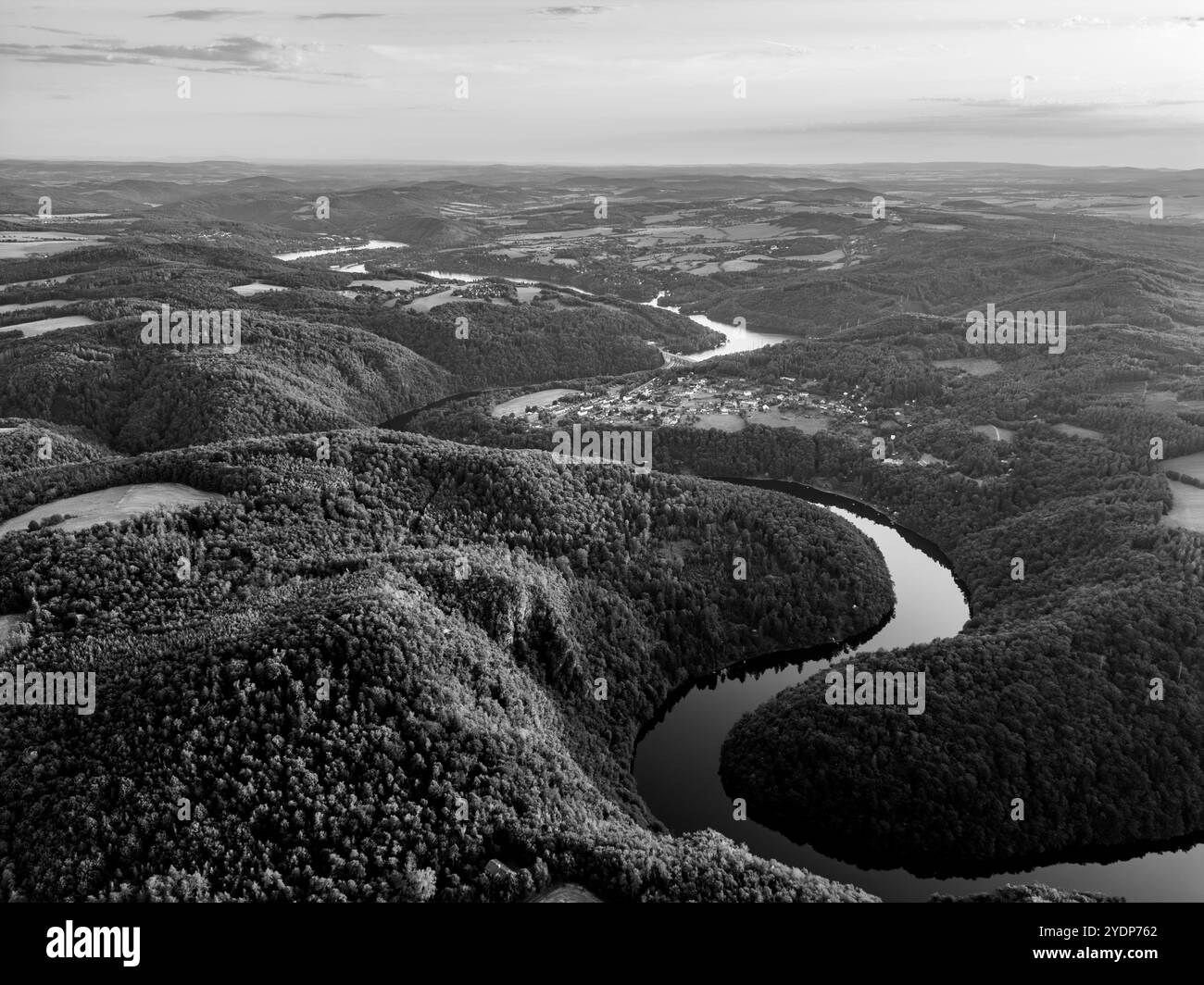 River through hills river through hills Black and White Stock Photos ...