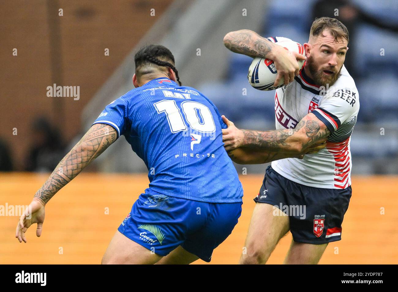 Daryl Clark of England evades the tackle of Terrell May of Samoa during ...