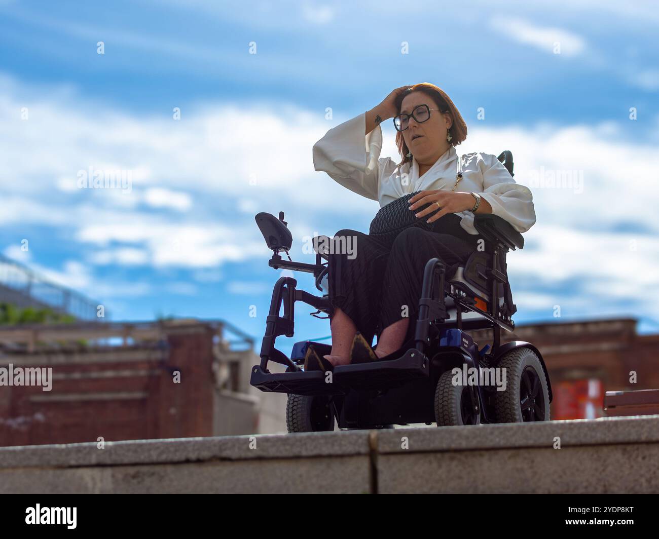 Woman in Electric Wheelchair Facing Outdoor Obstacle Stock Photo - Alamy