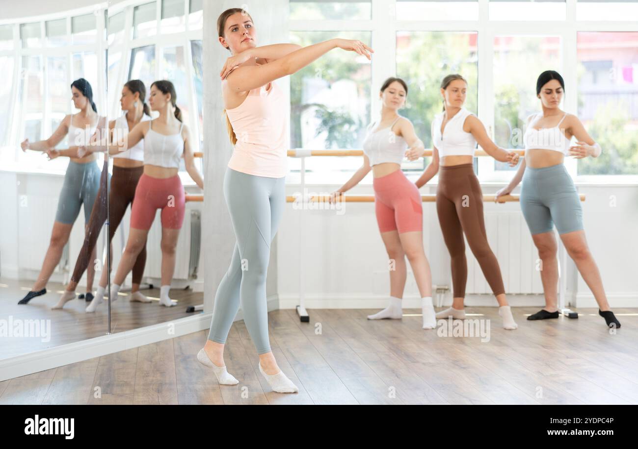 Young girl demonstrating ballet positions during choreography classes ...