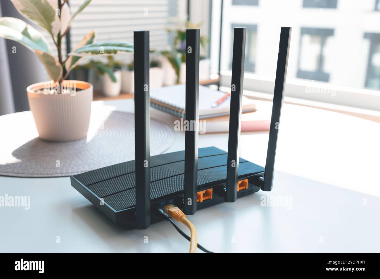 Black wifi router with four antennas. Fast wireless network concept ...