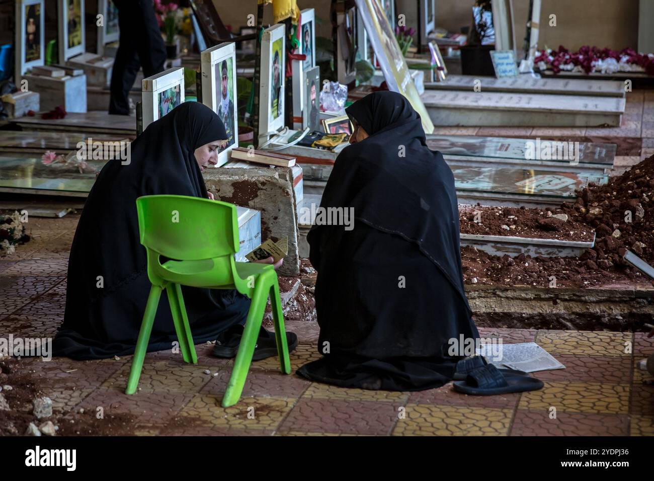 Women mourn at a grave at the Rawdat Alhawra' Zaynab cemetery for Shia ...