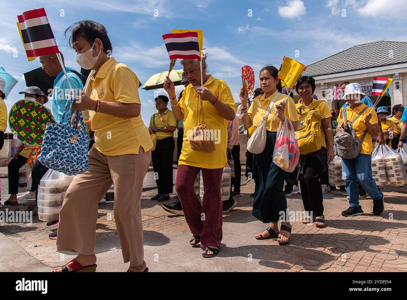 Bangkok, Thailand. 27th Oct, 2024. Spectators queue to watch the royal ...