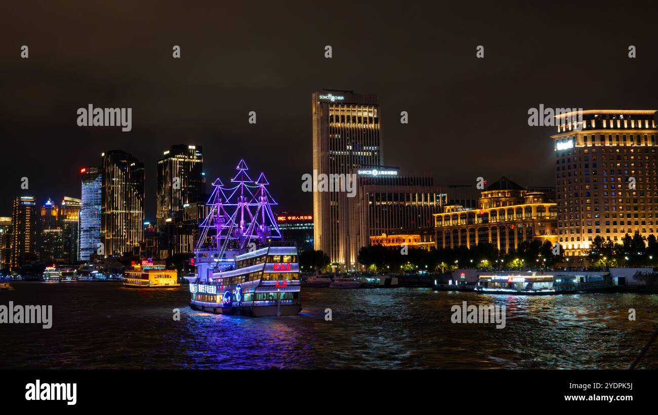 Shanghai night time city skyline over the Yangtze Stock Photo - Alamy