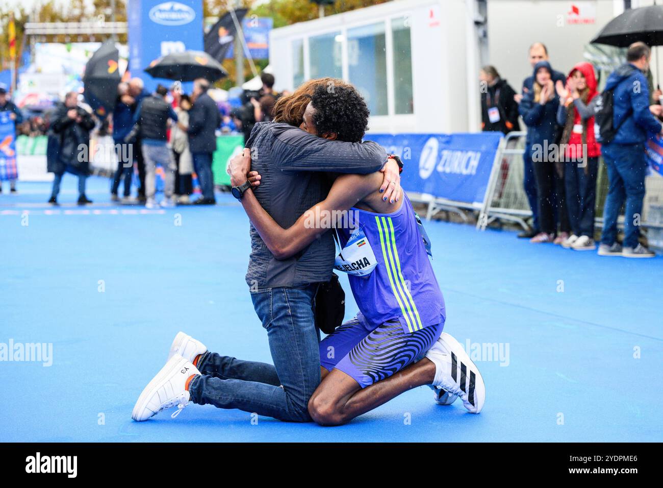 Ethiopian runner Yomif Kejelcha kneeling hugging his Manager after ...