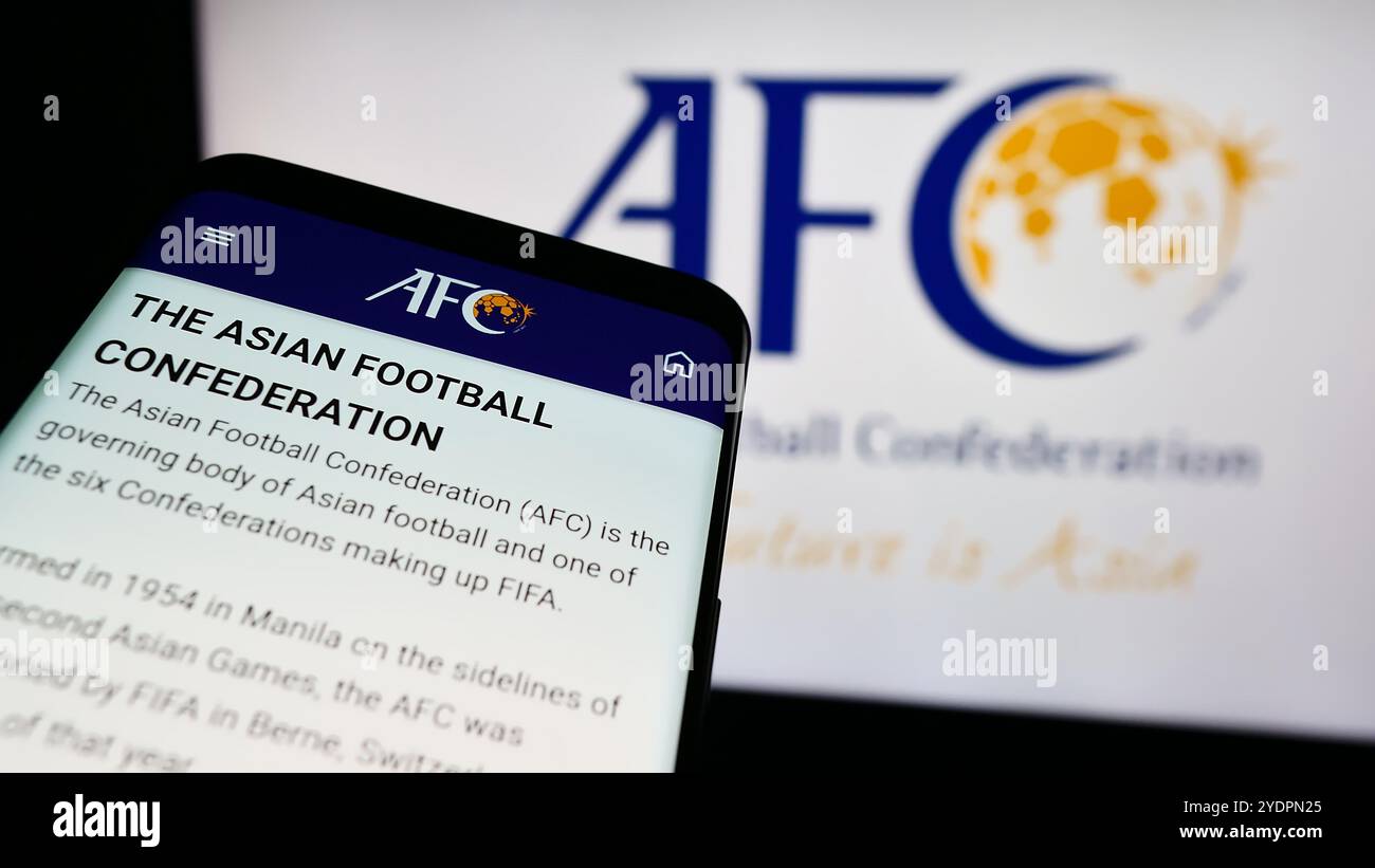 In this photo illustration, a mobile phone with the website of ...