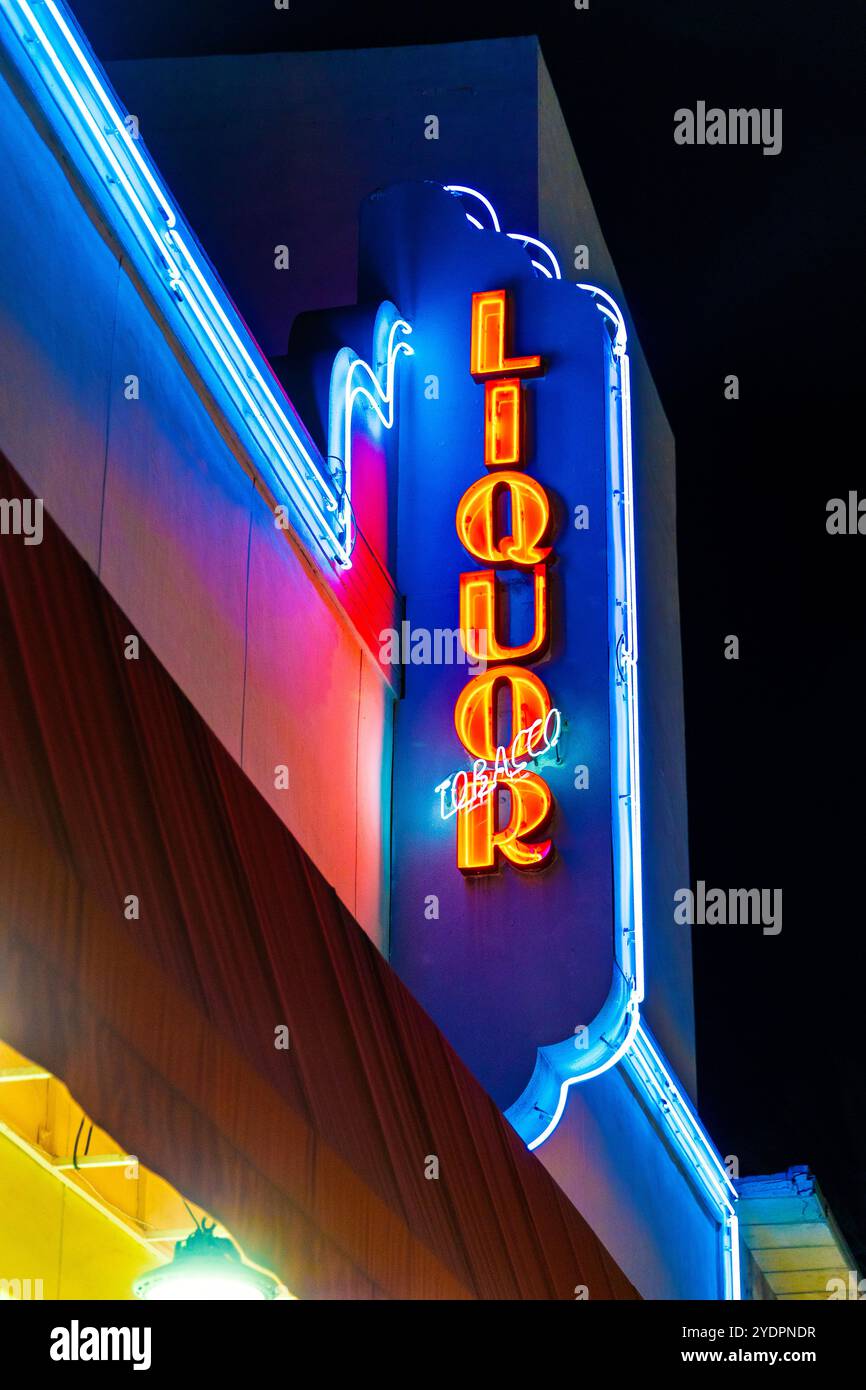 Liquor Tobacco neon sign at night at a liquor store on Collis Avenue ...