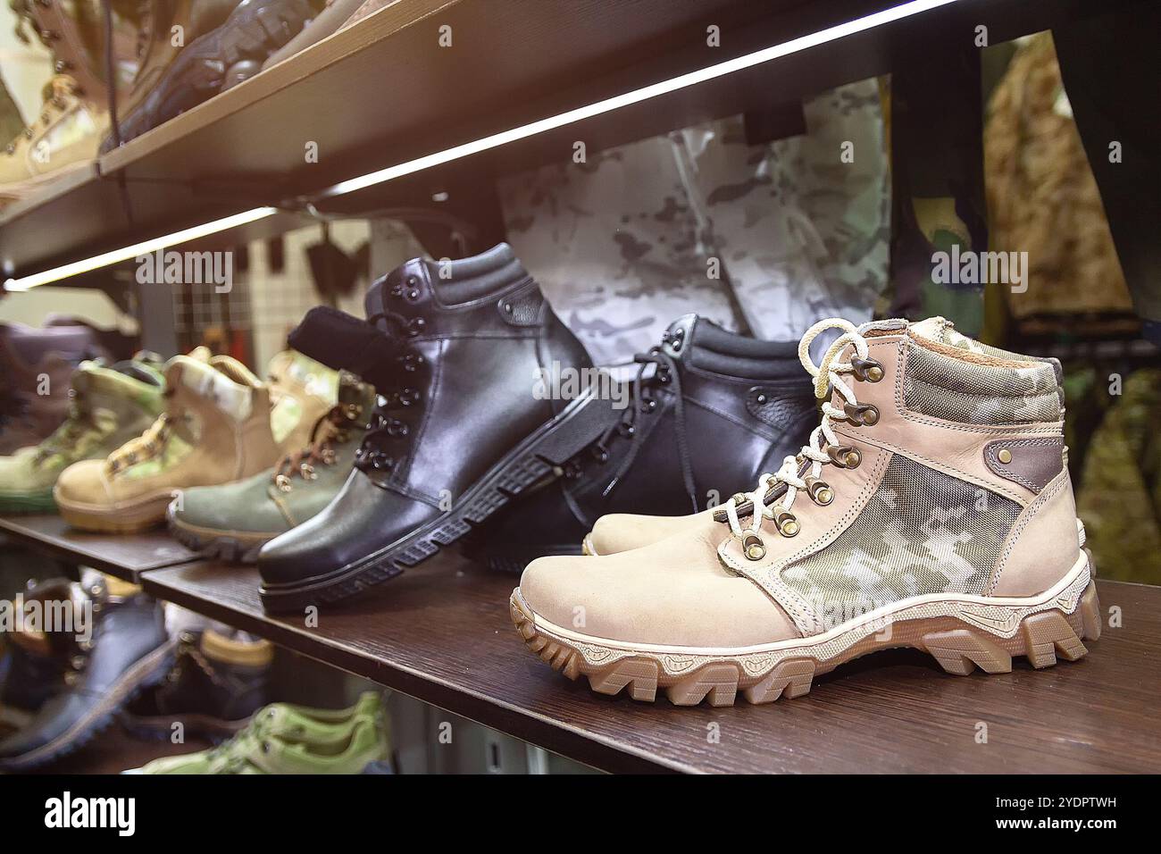 Army boots are in line at the store counter. Shoes Stock Photo - Alamy