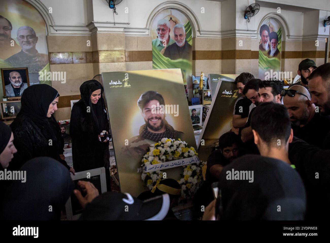 Mourners attend a funeral at the Rawdat Alhawra' Zaynab cemetery for ...