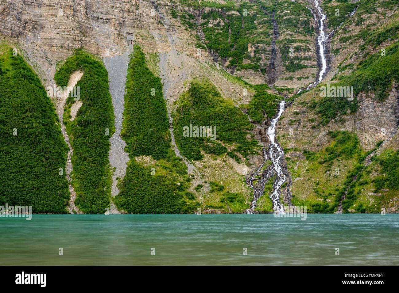 Avalanche Chutes Parallel A Waterfall Down The Wall Above Frances Lake ...