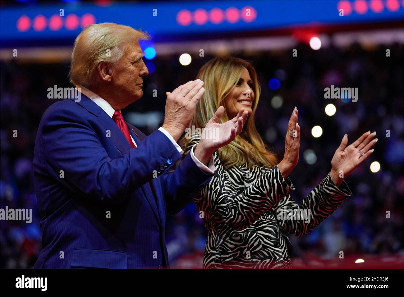 Republican presidential nominee former President Donald Trump applauds ...