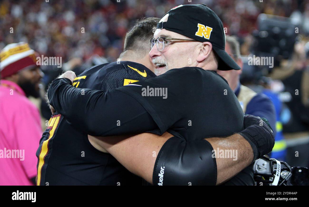 Washington Commanders head coach Dan Quinn hugs Washington Commanders ...