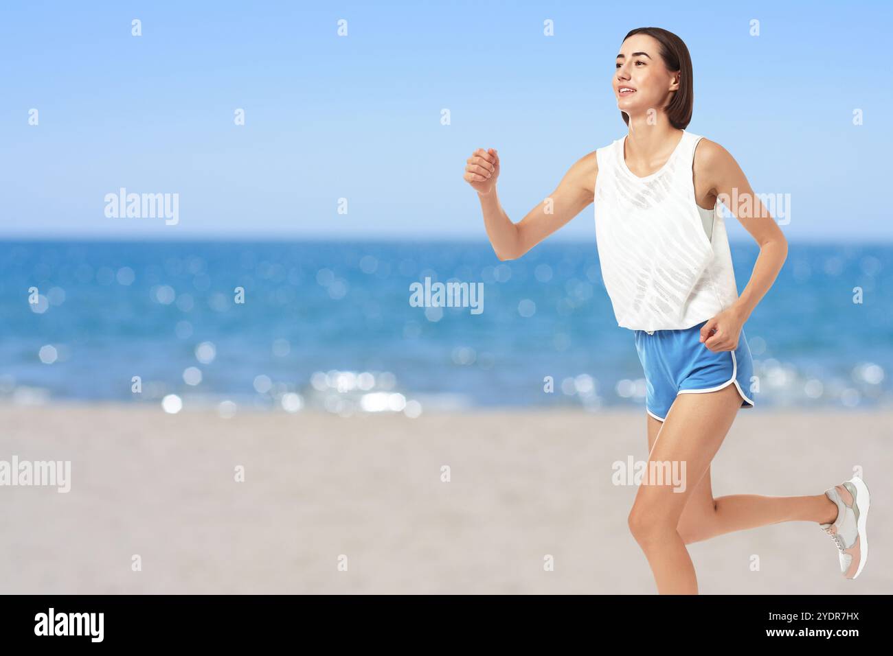 Beautiful woman running on beach. Space for text Stock Photo - Alamy