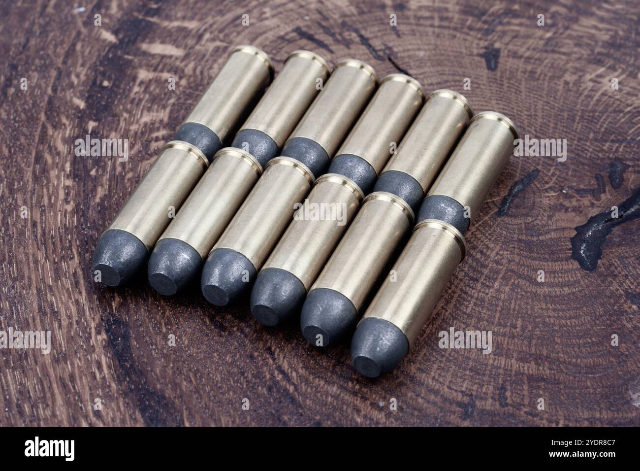 Old West era Long Colt .45 caliber revolver cartridges on a wooden ...