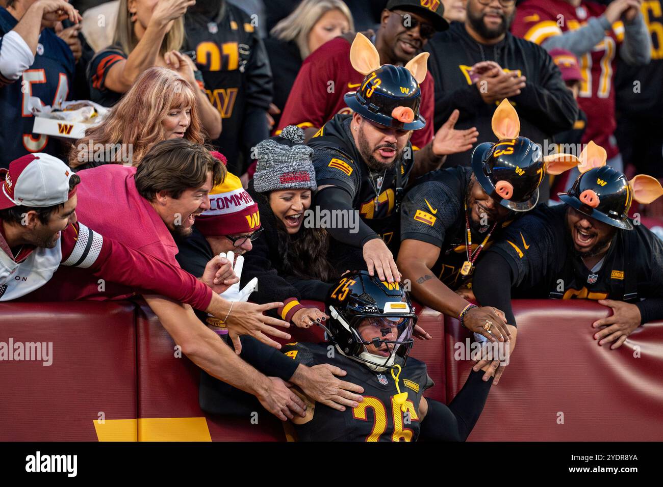 Washington commanders running back Jeremy McNichols (26) interacts with ...