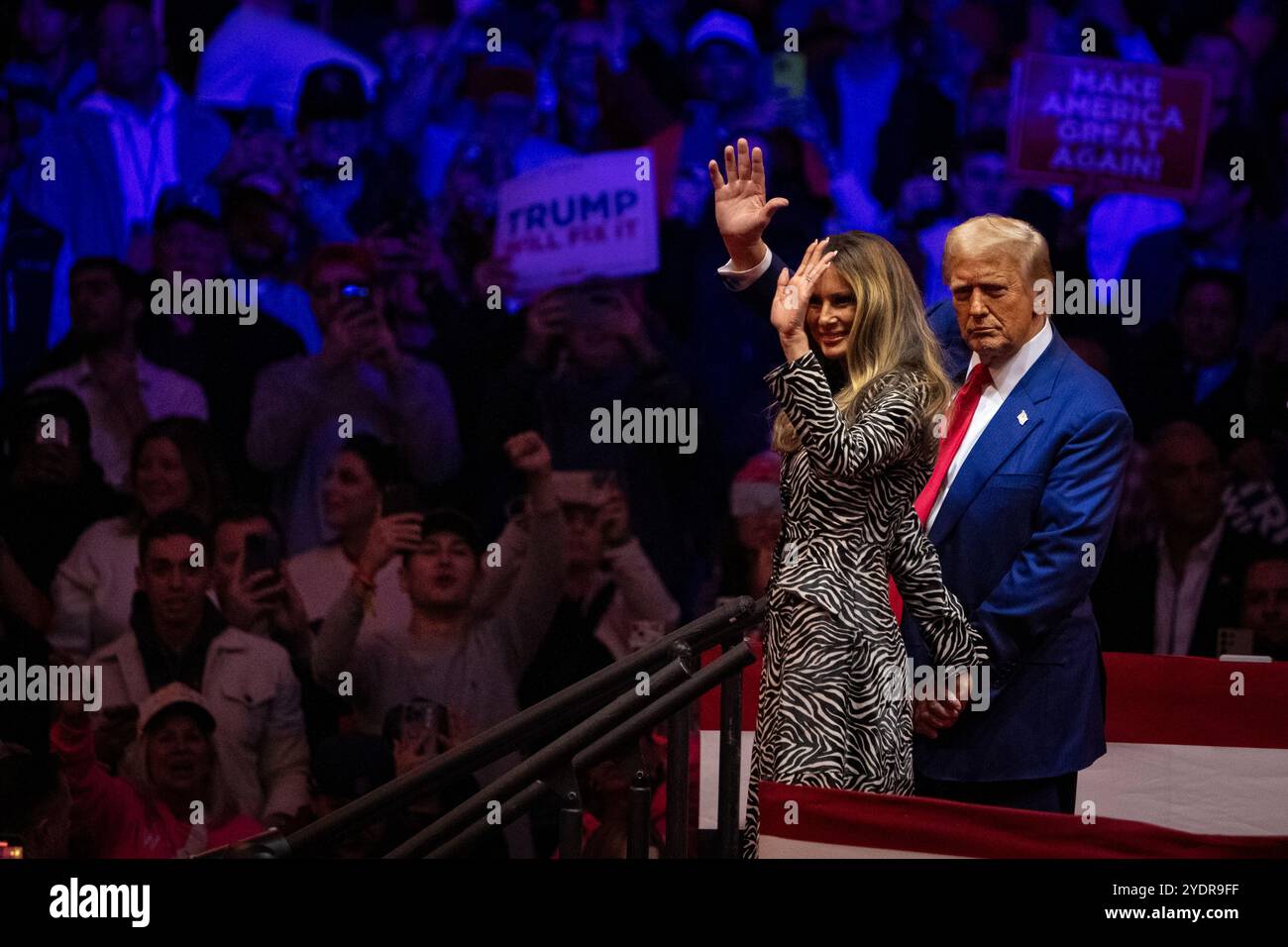 Former president Donald J. Trump and his wife Melania wave goodbye to ...