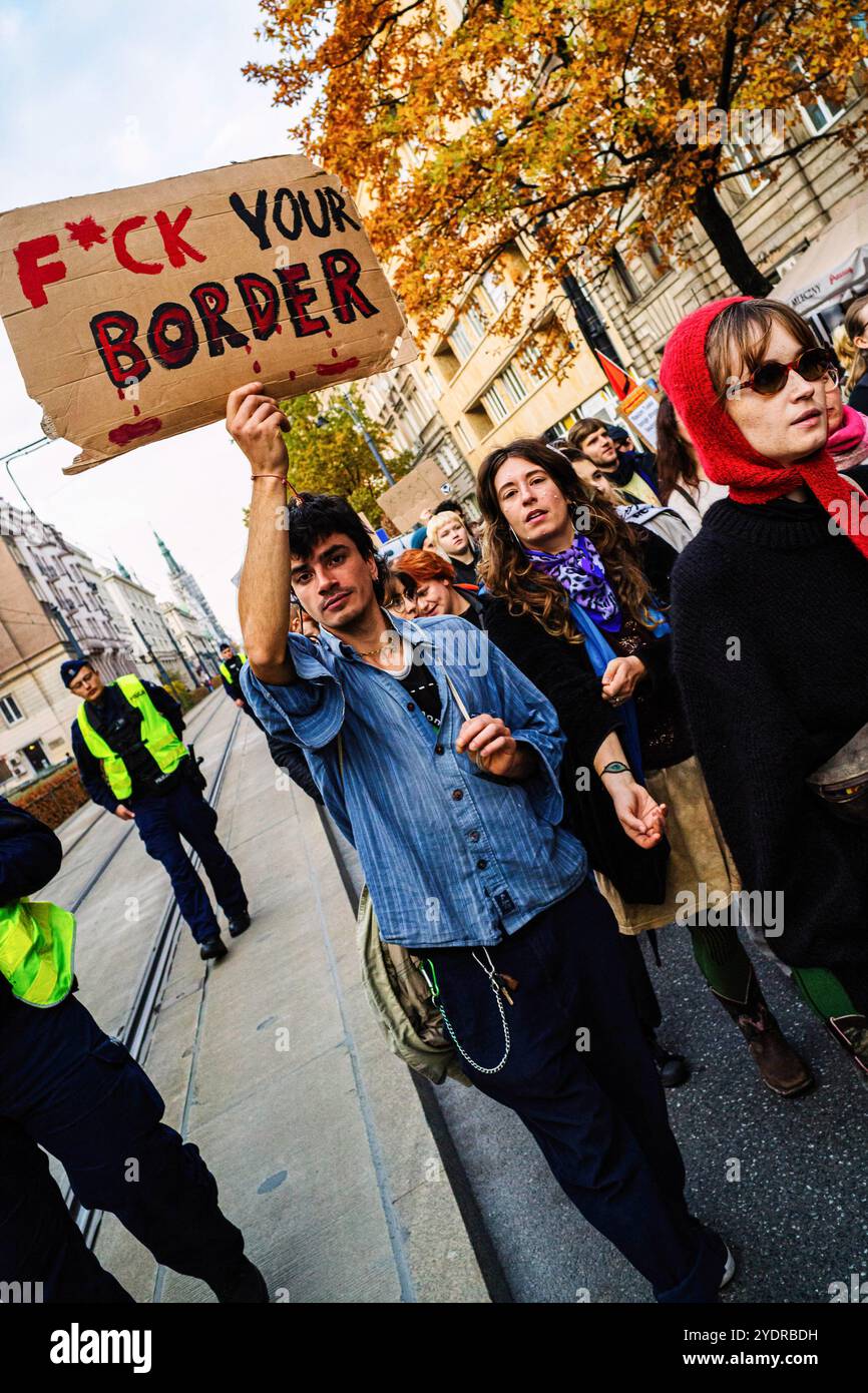 (EDITORS NOTE: Image contains profanity) A protestor raises high a ...