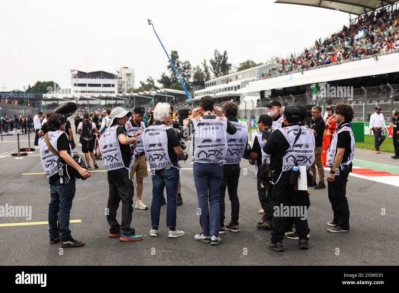 APX GP Team crew filming on the starting grid for the Apex F1 movie by ...
