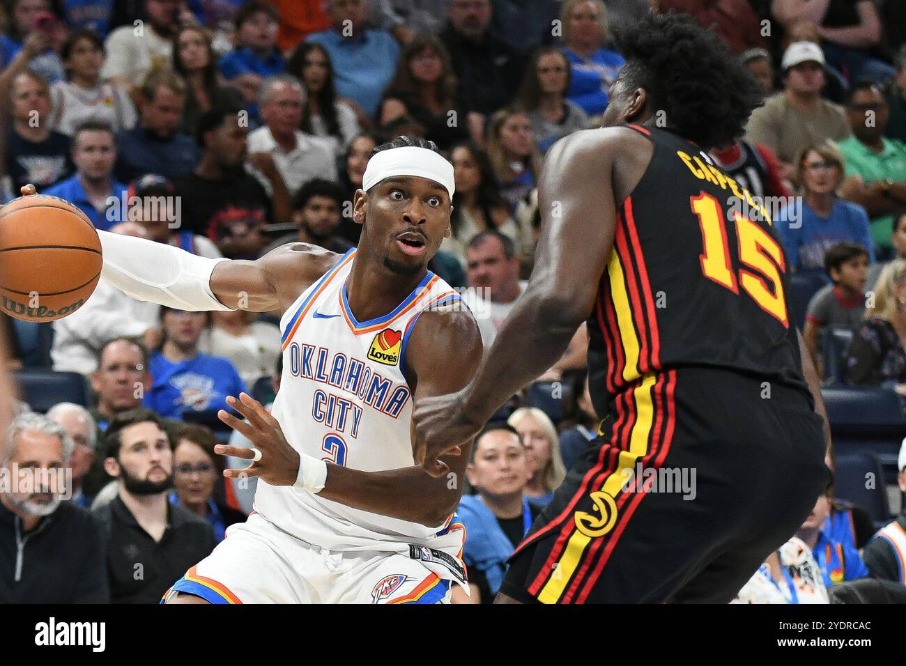 Oklahoma City Thunder guard Shai Gilgeous-Alexander, left, looks for an ...
