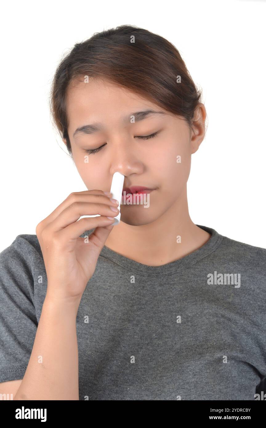 Asian girl holds nose inhaler isolated on white background Stock Photo ...