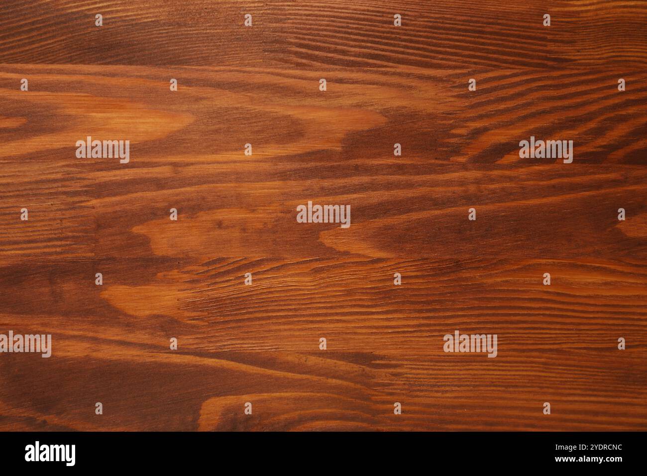 Applying walnut wood stain. Texture of wooden surface as background ...