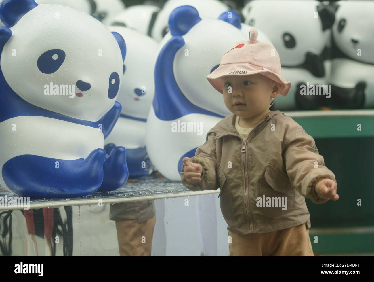 HANGZHOU, CHINA - OCTOBER 28, 2024 - Visitors look at an art ...