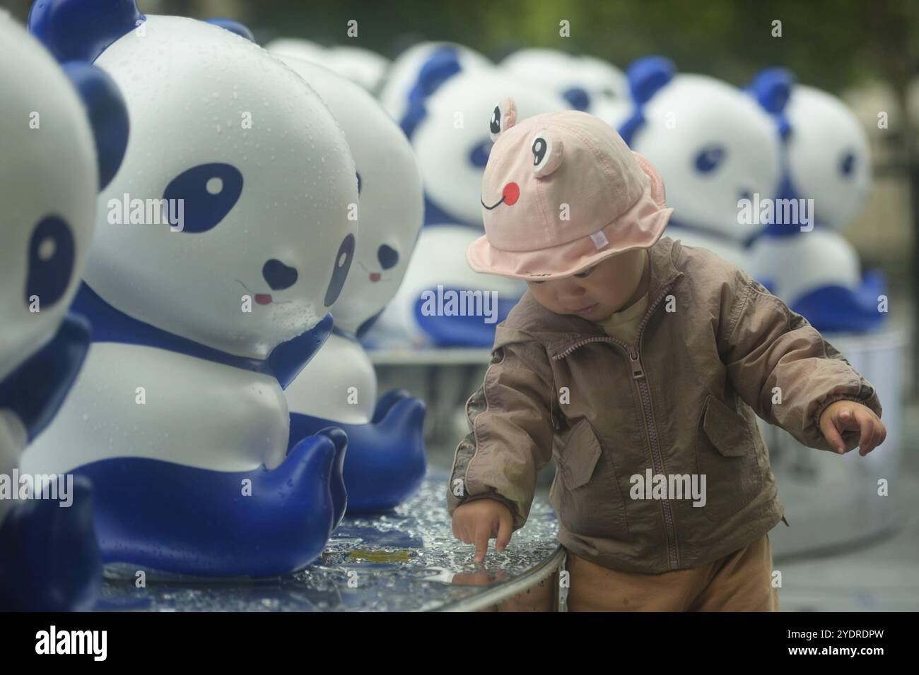HANGZHOU, CHINA - OCTOBER 28, 2024 - Visitors look at an art ...