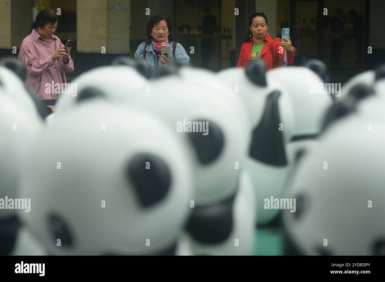 HANGZHOU, CHINA - OCTOBER 28, 2024 - Visitors look at an art installation of the "Giant Panda ...