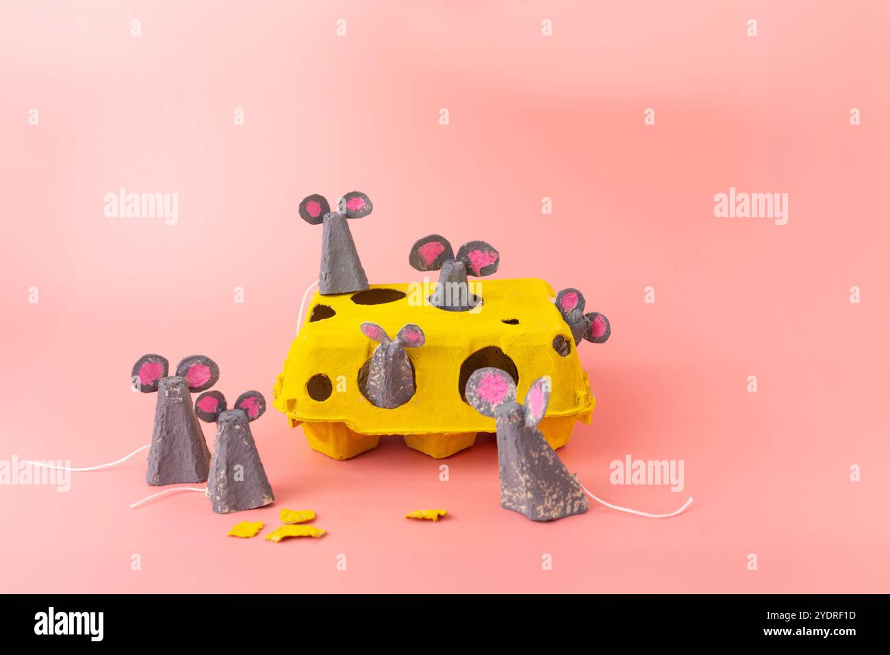 Yellow egg carton transformed into cheese with peeking mouse figurines ...