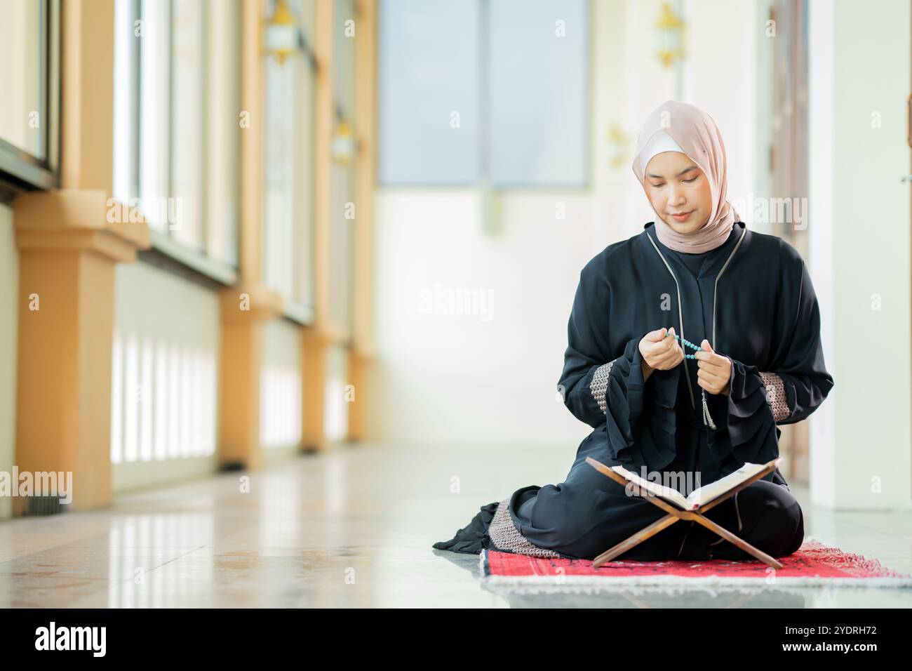 The image of an Asian Muslim woman in the Islamic religion in hijab in ...