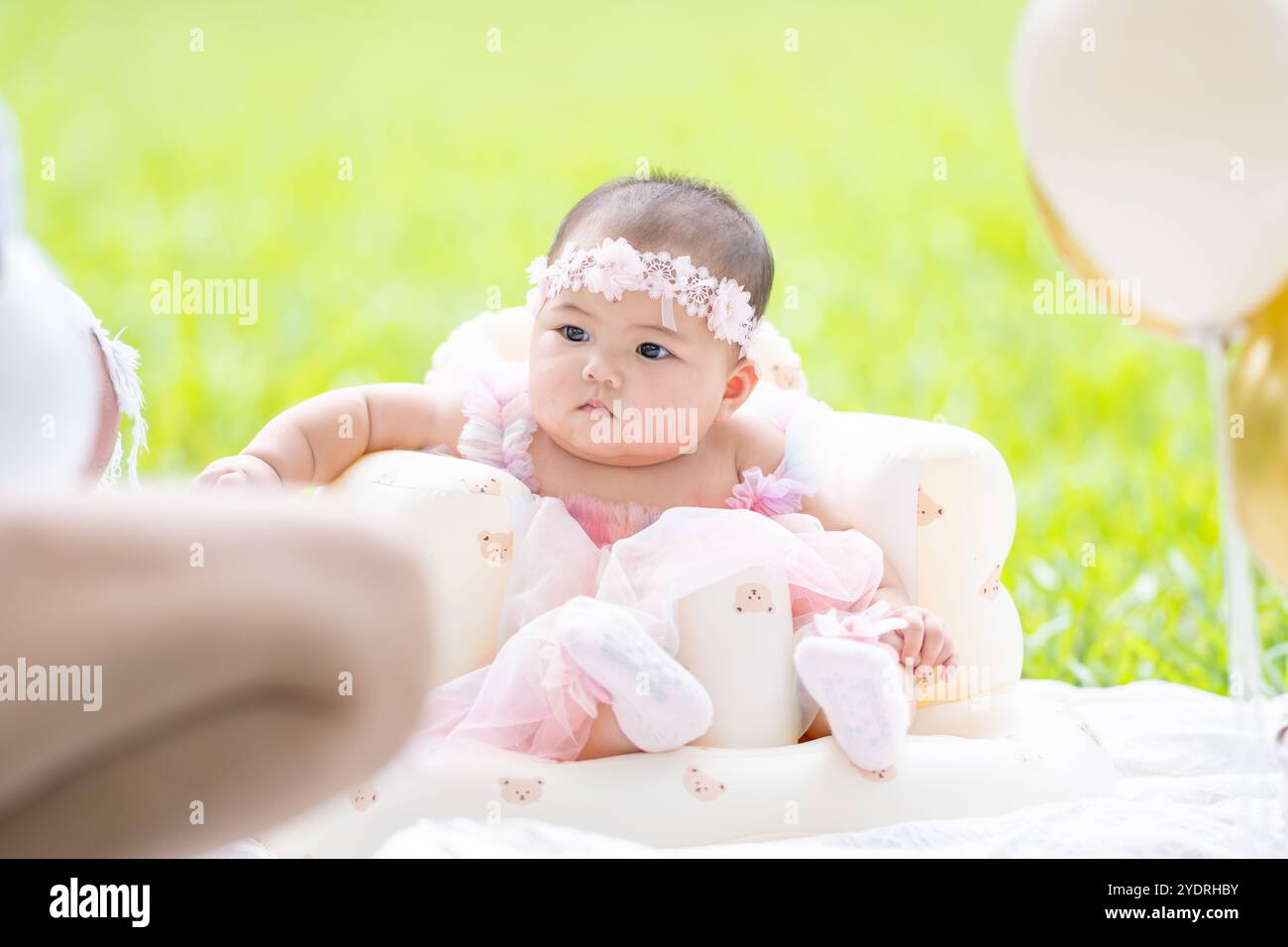 A Taiwanese couple in their 20s and their 7-month-old baby celebrate ...