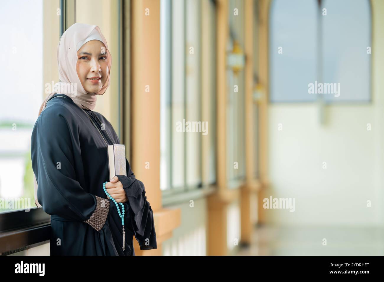 The image of an Asian Muslim woman in the Islamic religion in hijab in ...