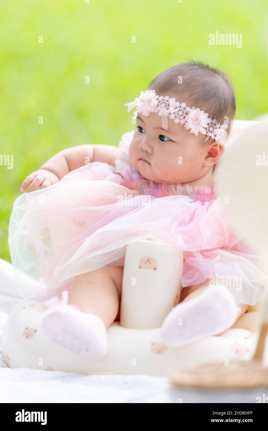 A Taiwanese couple in their 20s and their 7-month-old baby celebrate ...